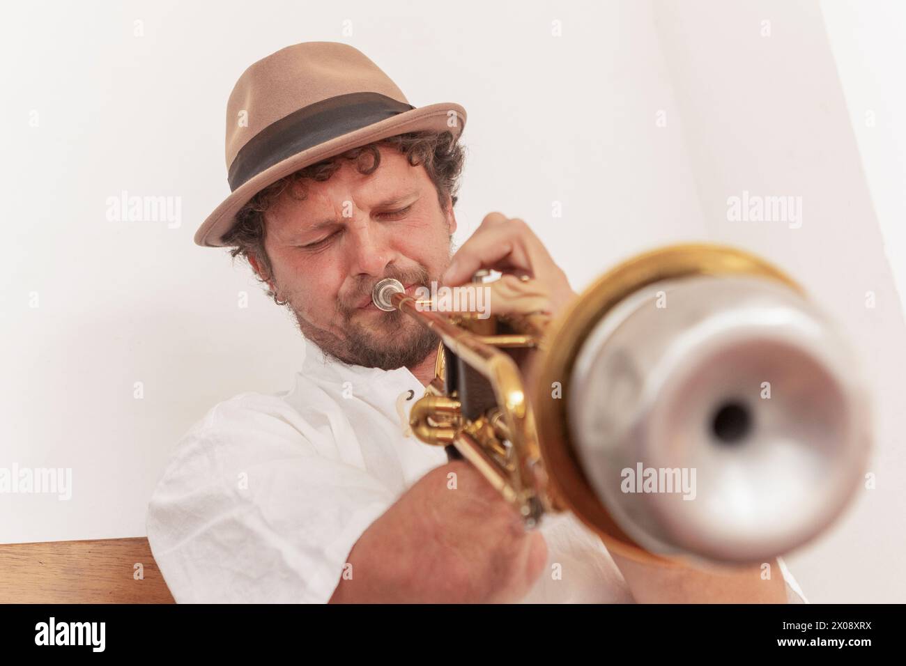 A one-armed trumpeter displaying determination and passion as he ...