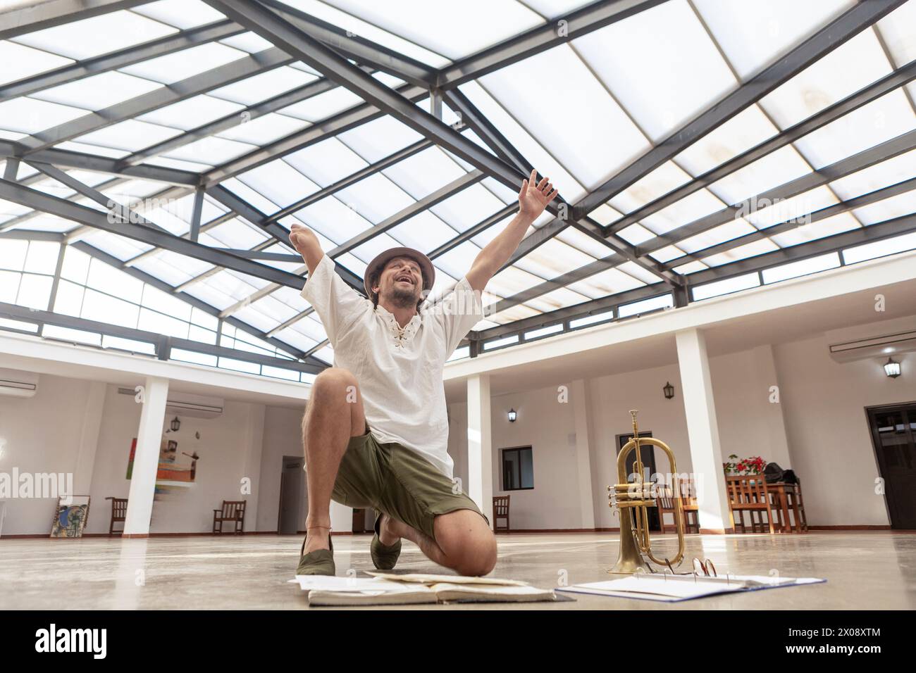 An inspirational one-armed trumpet player practices enthusiastically in ...