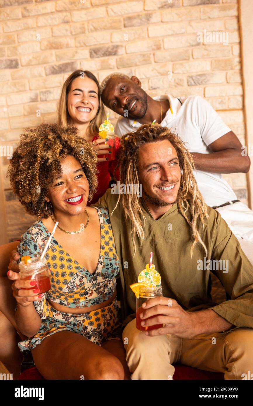 A cheerful quartet of friends share a joyful moment over colorful ...