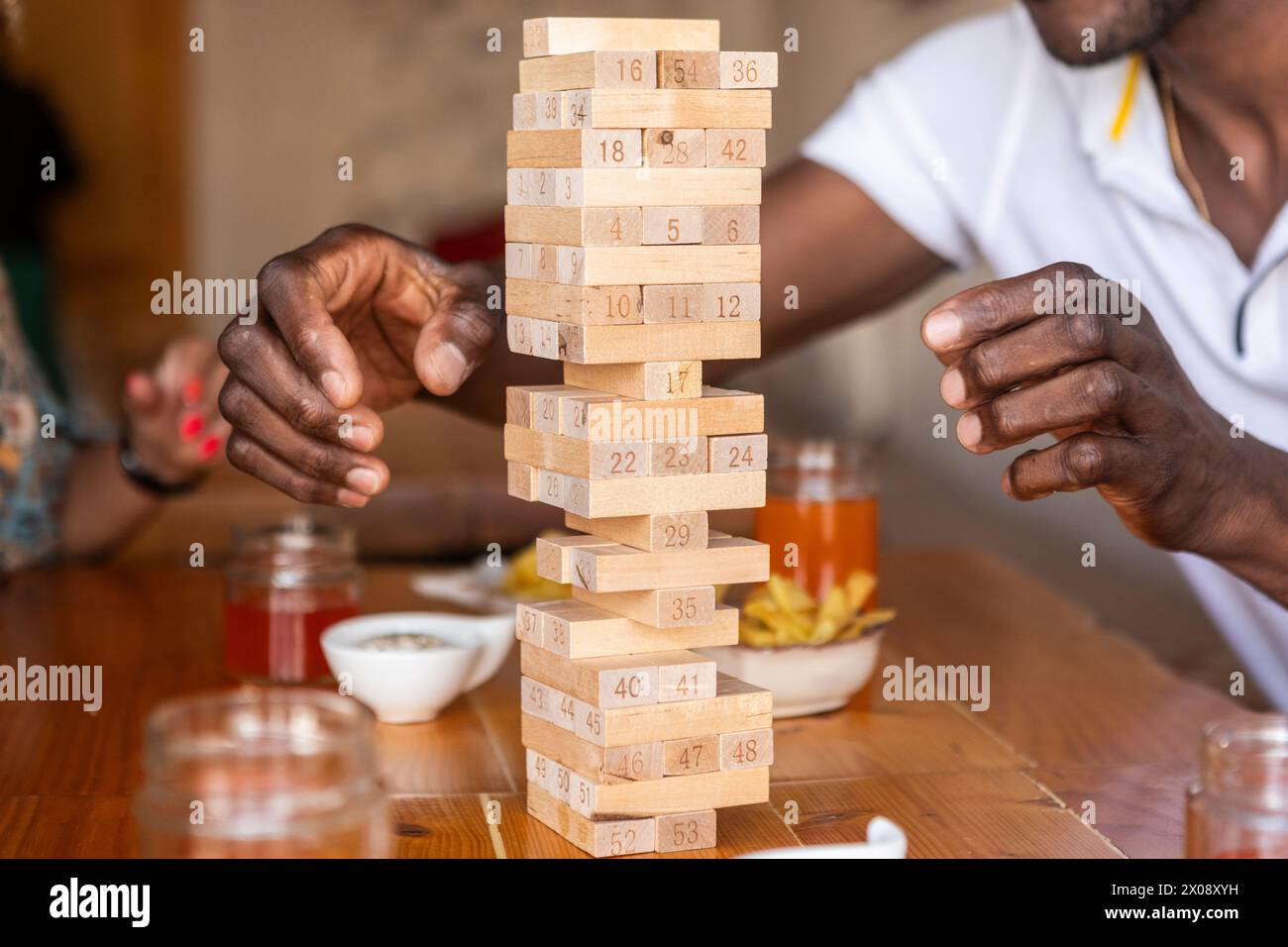 Jenga tower hand hi-res stock photography and images - Alamy