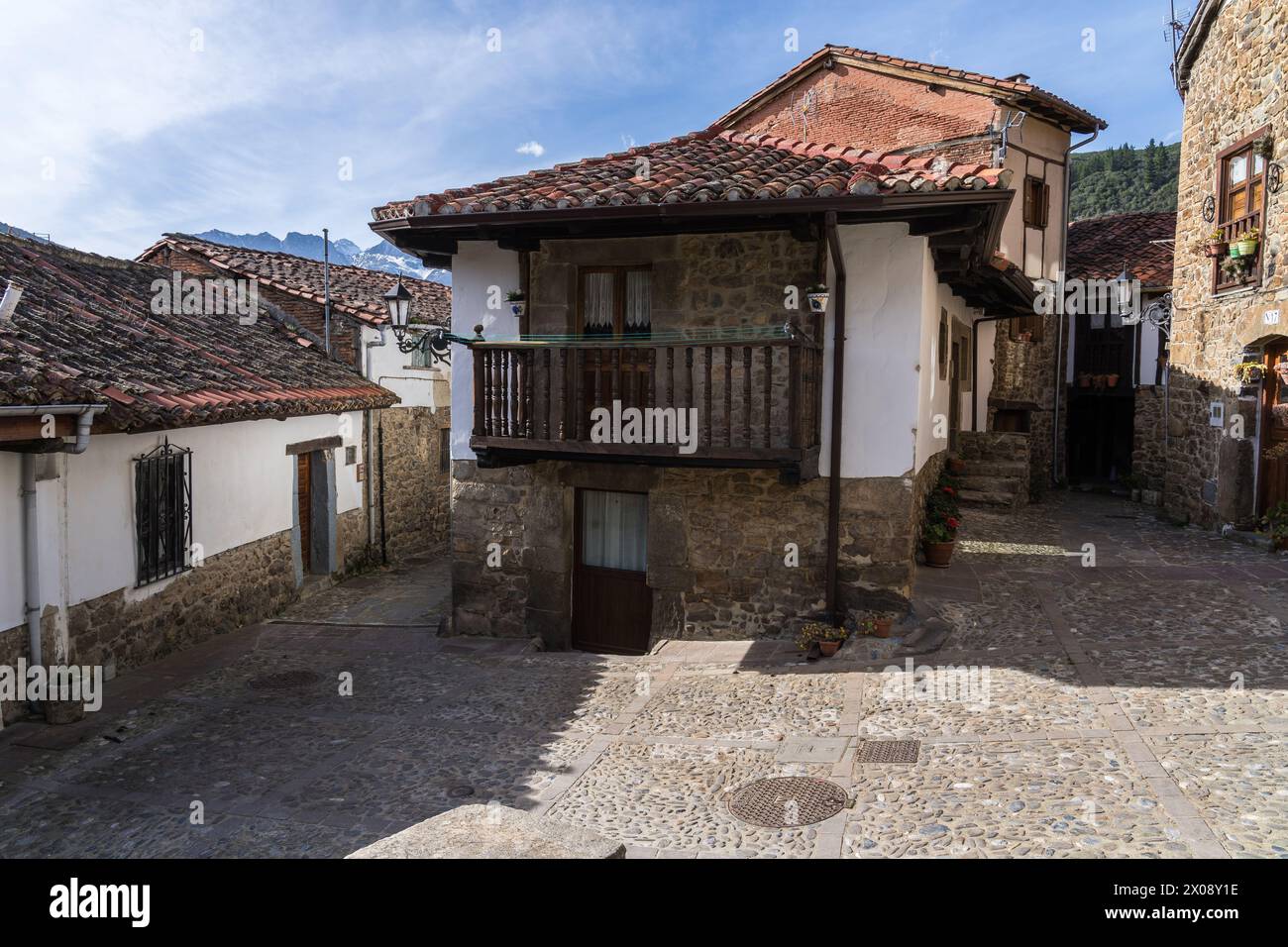 Charming cobblestone streets with traditional stone houses in Potes ...