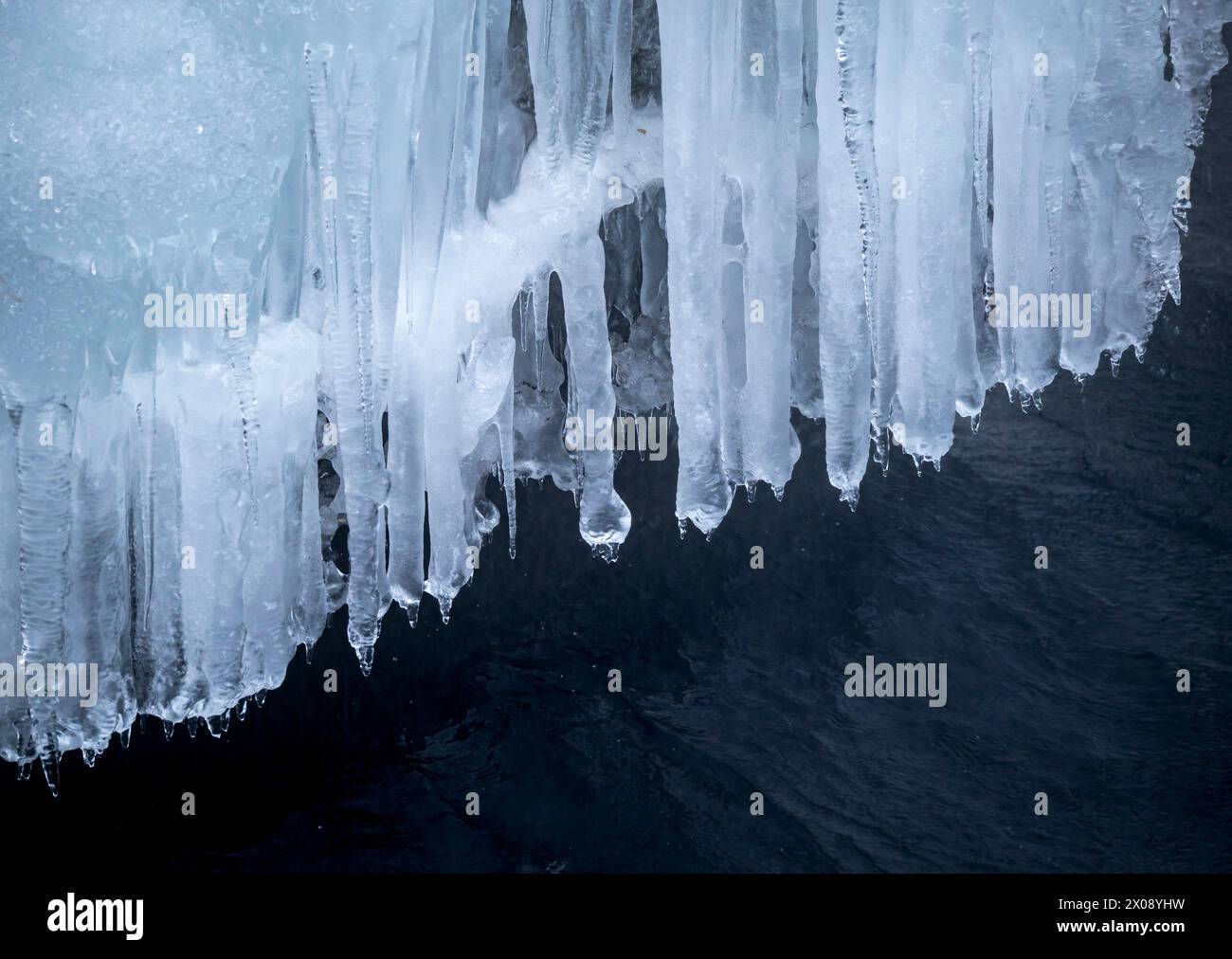 Icicles hang from rock above hi-res stock photography and images - Alamy