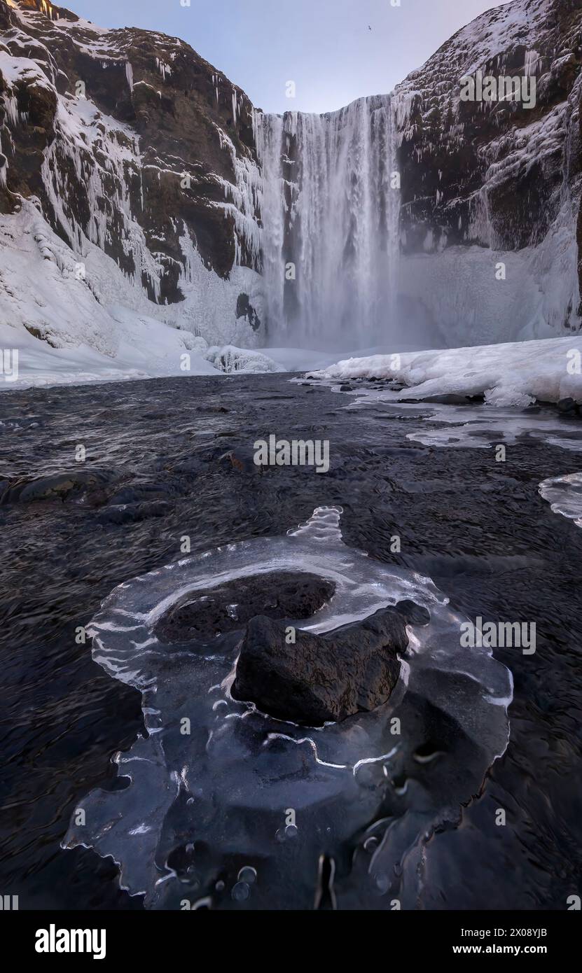 An awe-inspiring photo capturing the raw beauty of a frozen waterfall ...