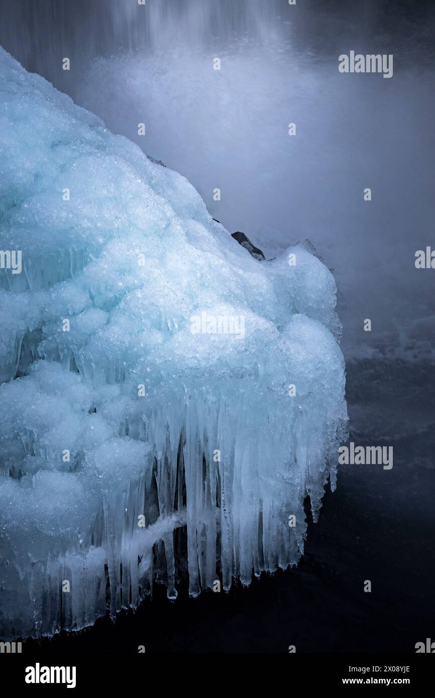 An awe-inspiring view of delicate icicles suspended beneath a ...