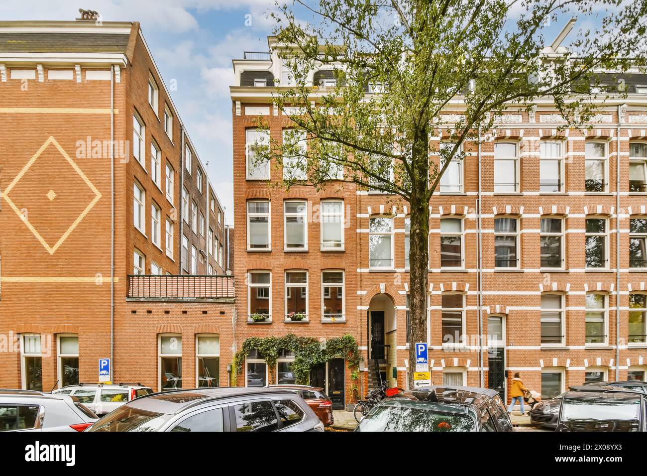 Traditional European red brick residential buildings line a quiet ...