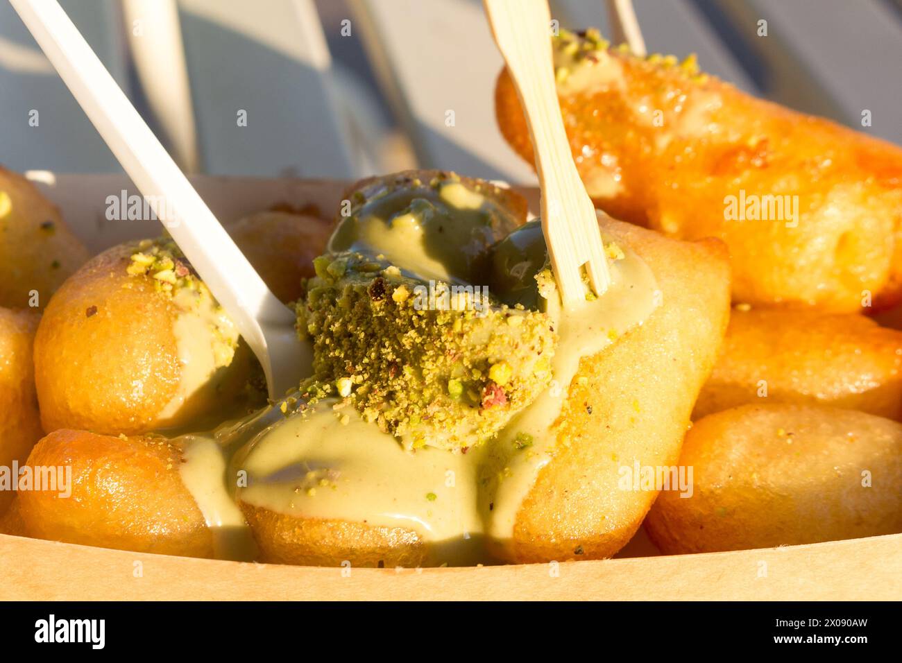Greek lukumades donuts with pistachio-nut sauce sauce with pistachio ...