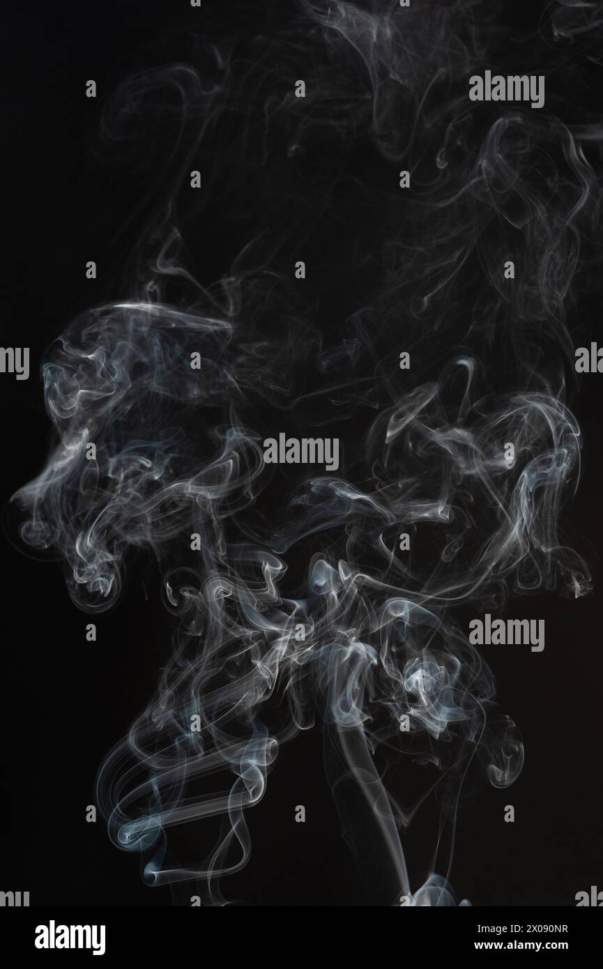 Fluffy smoke lines and clouds on black background close up view Stock ...