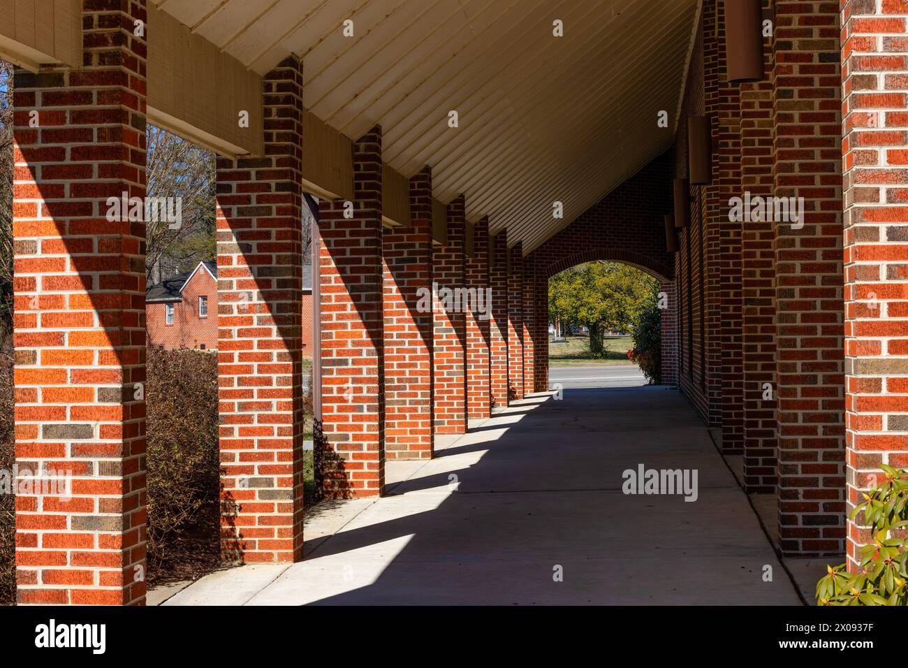 Outdoor covered walkway attached to a brick building in downtown Big ...