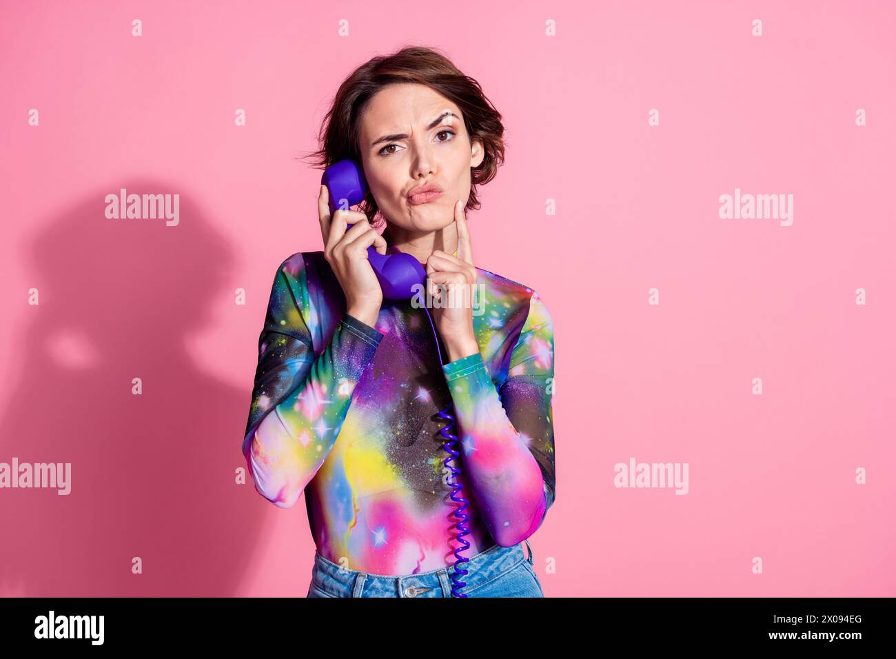 Photo of nice young woman talk phone contemplate wear pullover isolated ...