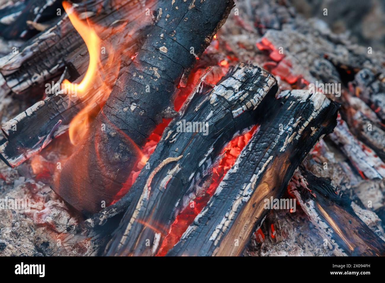Bonfire of burning logs with flames of red and orange color Stock Photo ...