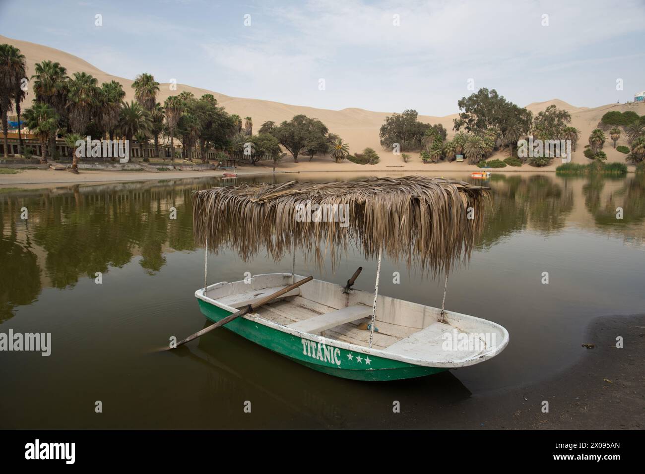 Huacachina oasis, a popular tourism destination, sits amongst expansive ...