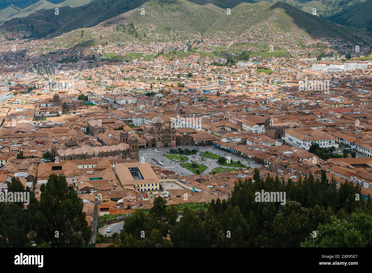 View of the historic city streets and clay houses of cusco city in ...