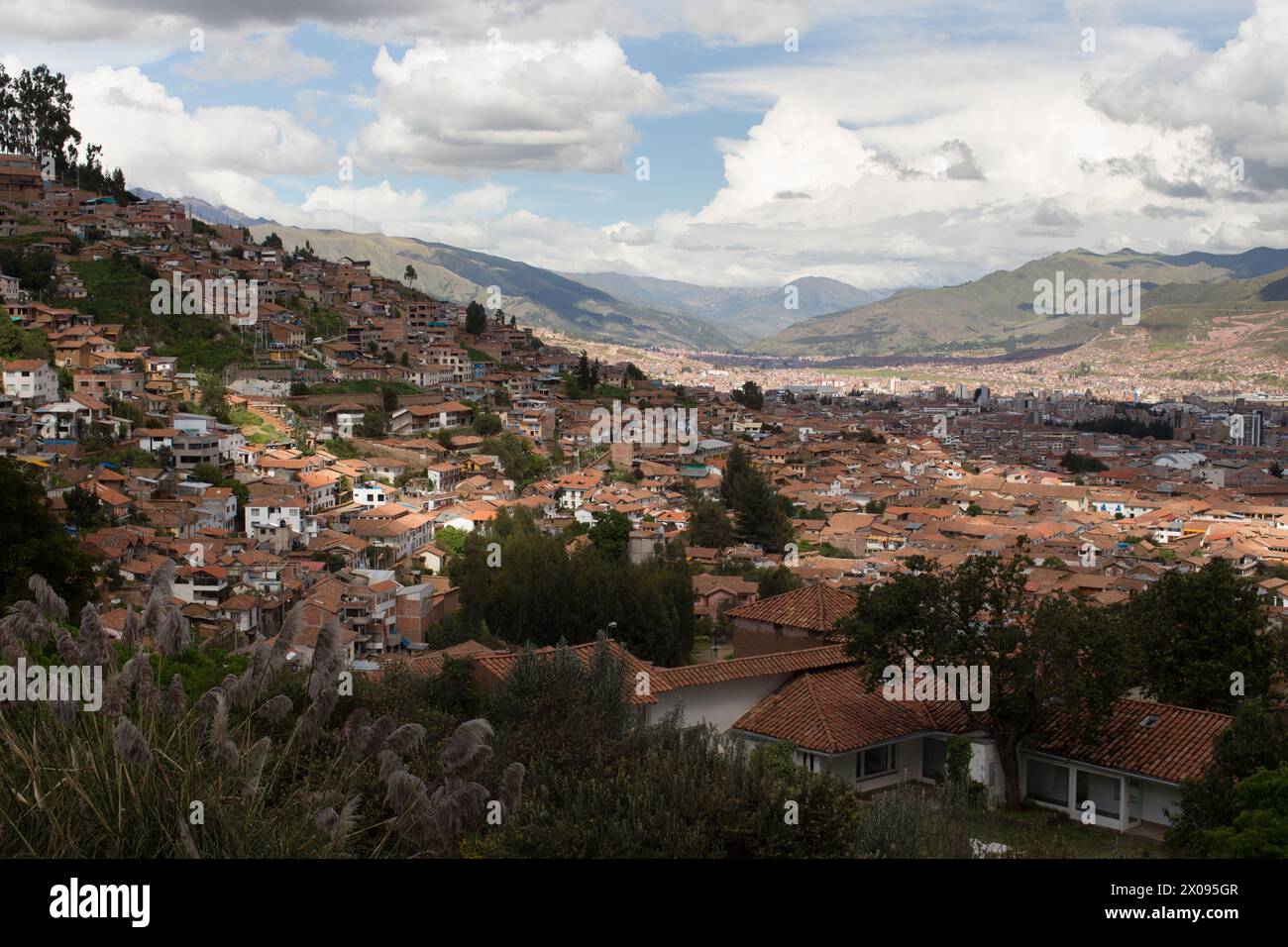 View of the historic city streets and clay houses of cusco city in ...