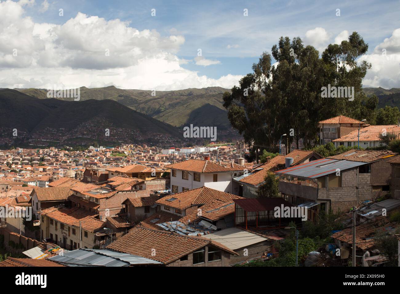 View of the historic city streets and clay houses of cusco city in ...
