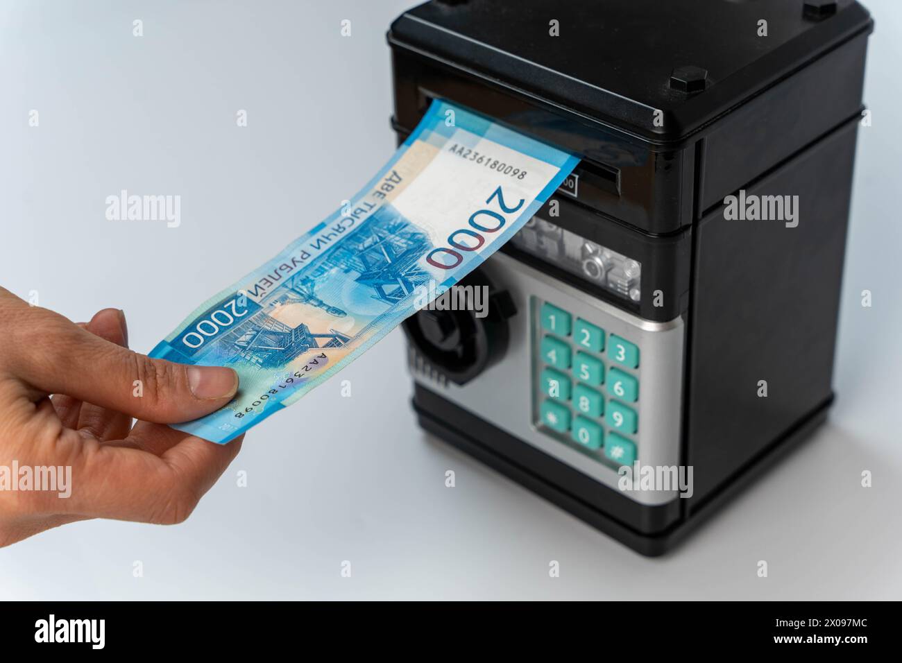 Planning budgeting concept hand placing hi-res stock photography and ...