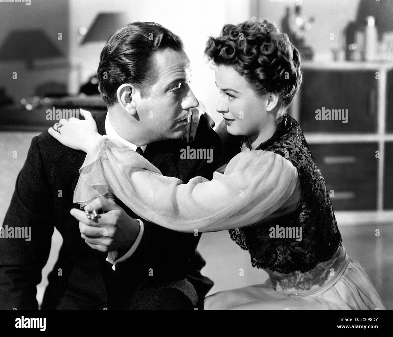 Melvyn Douglas, Osa Massen, on-set of the film, "A Woman's Face", Loew ...