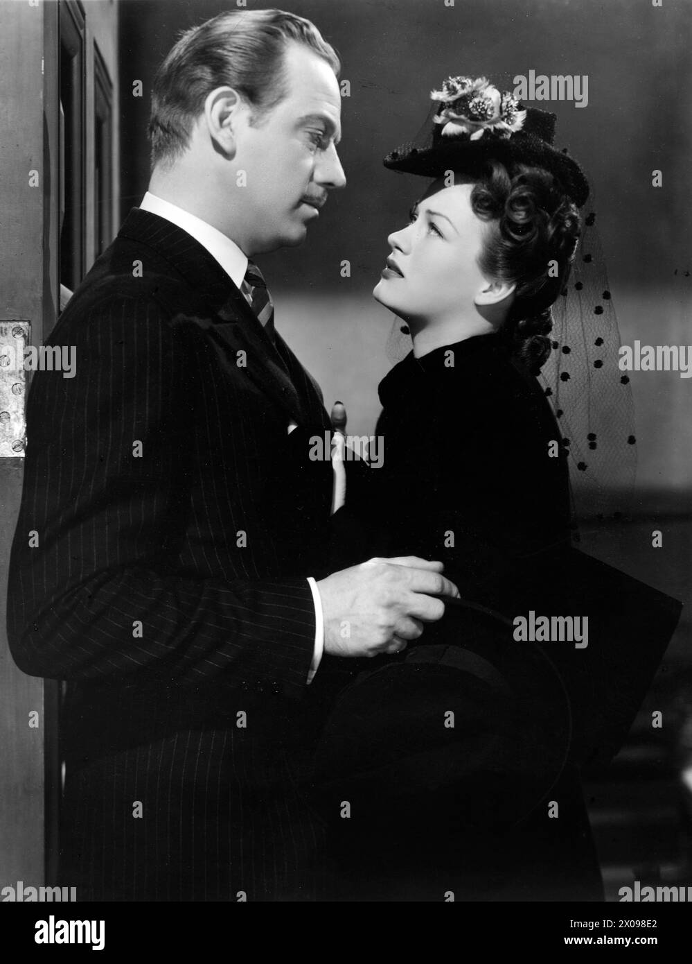 Melvyn Douglas, Osa Massen, on-set of the film, "A Woman's Face", Loew's, Inc., 1941 Stock Photo ...