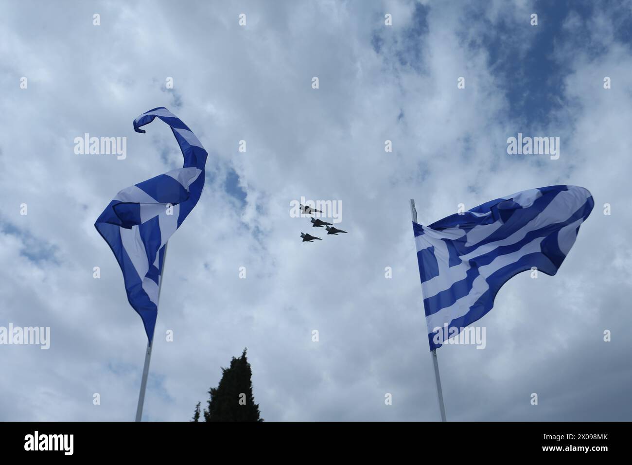 Airplanes and helicopters fly during a military parade commemorating ...