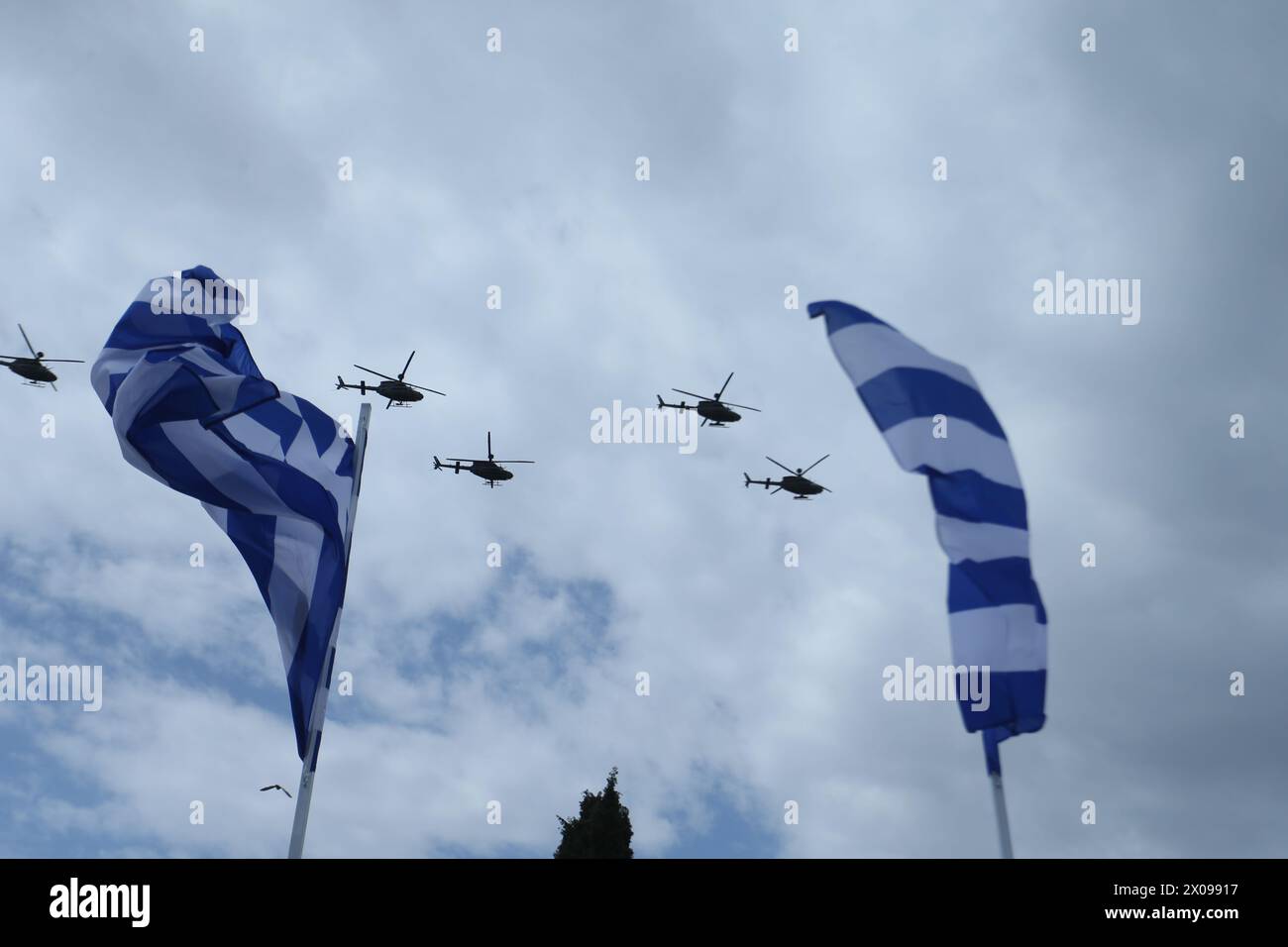 Airplanes and helicopters fly during a military parade commemorating ...