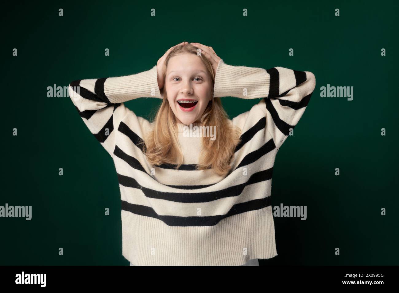 Woman With Long Red Hair Wearing Striped Sweater Stock Photo - Alamy