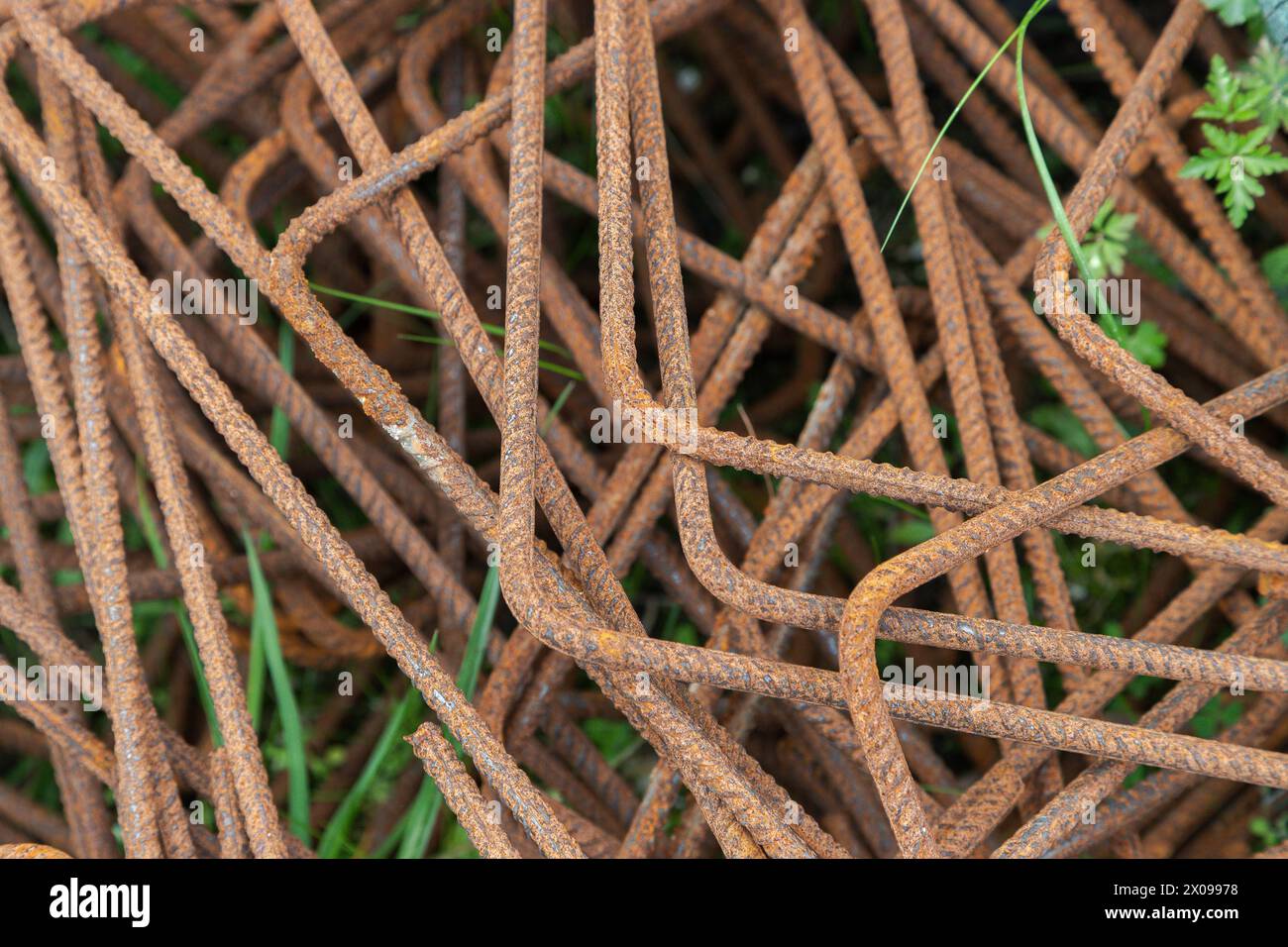 Curved steel bars for reinforcement in construction works. Rusty metal ...