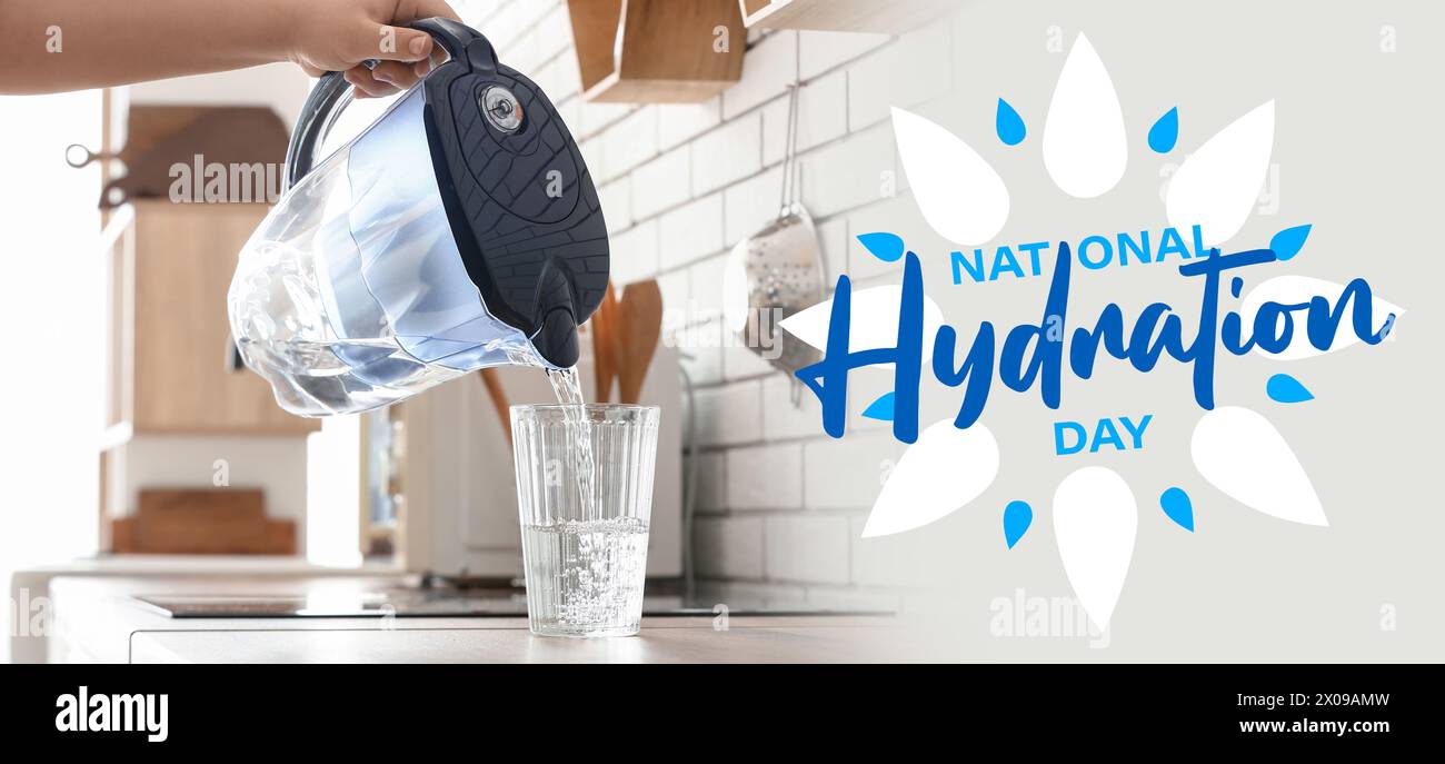 Woman pouring water from filter jug into glass on kitchen counter ...