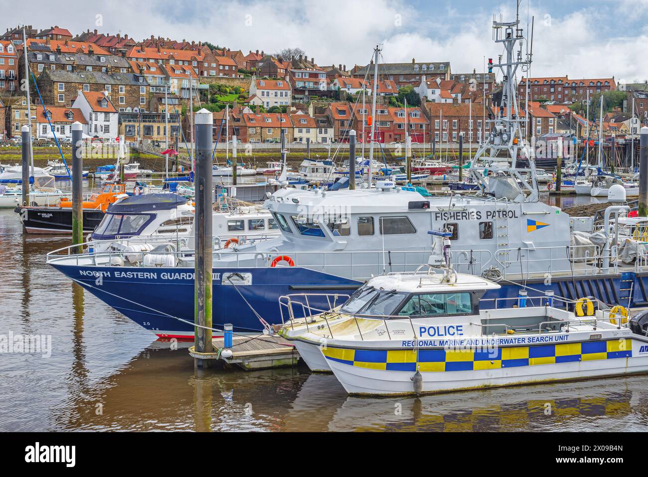 A fisheries patrol boat and a police vessel are moored in Whitby marina ...