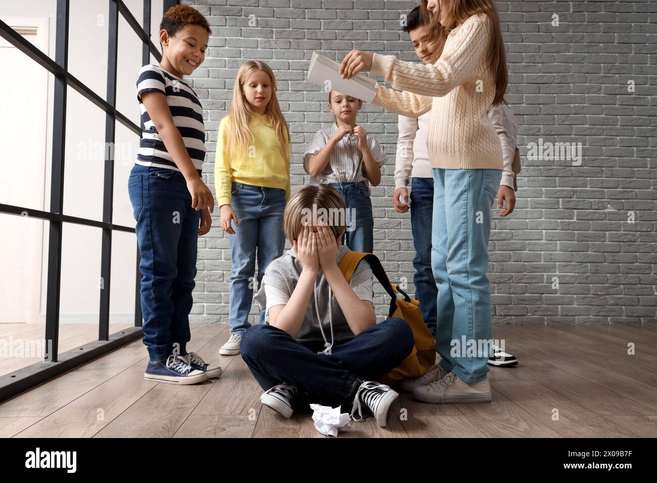 Bullied little boy with his classmates crying at school Stock Photo - Alamy