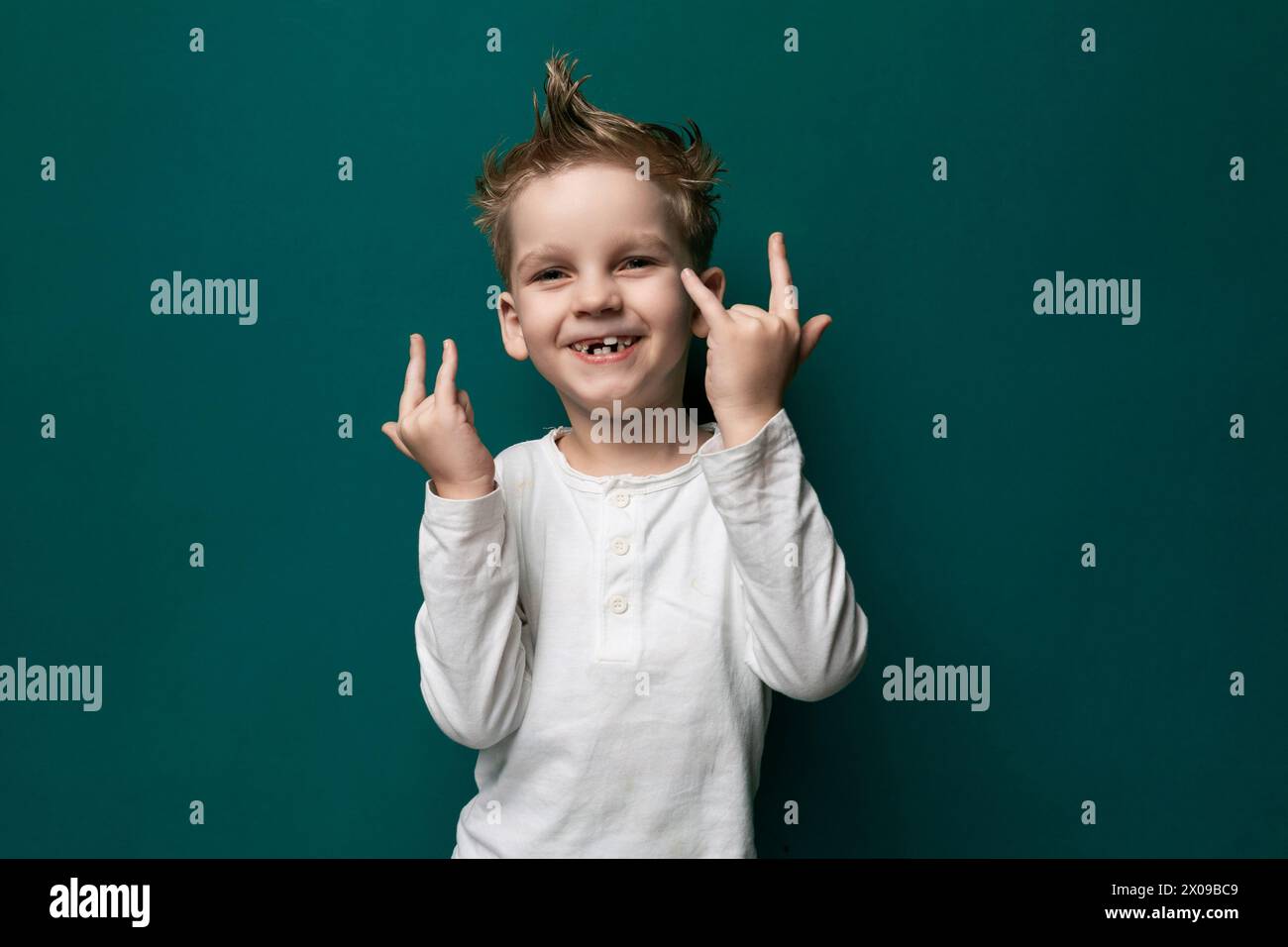 Little Boy Making a Peace Sign With His Hands Stock Photo - Alamy