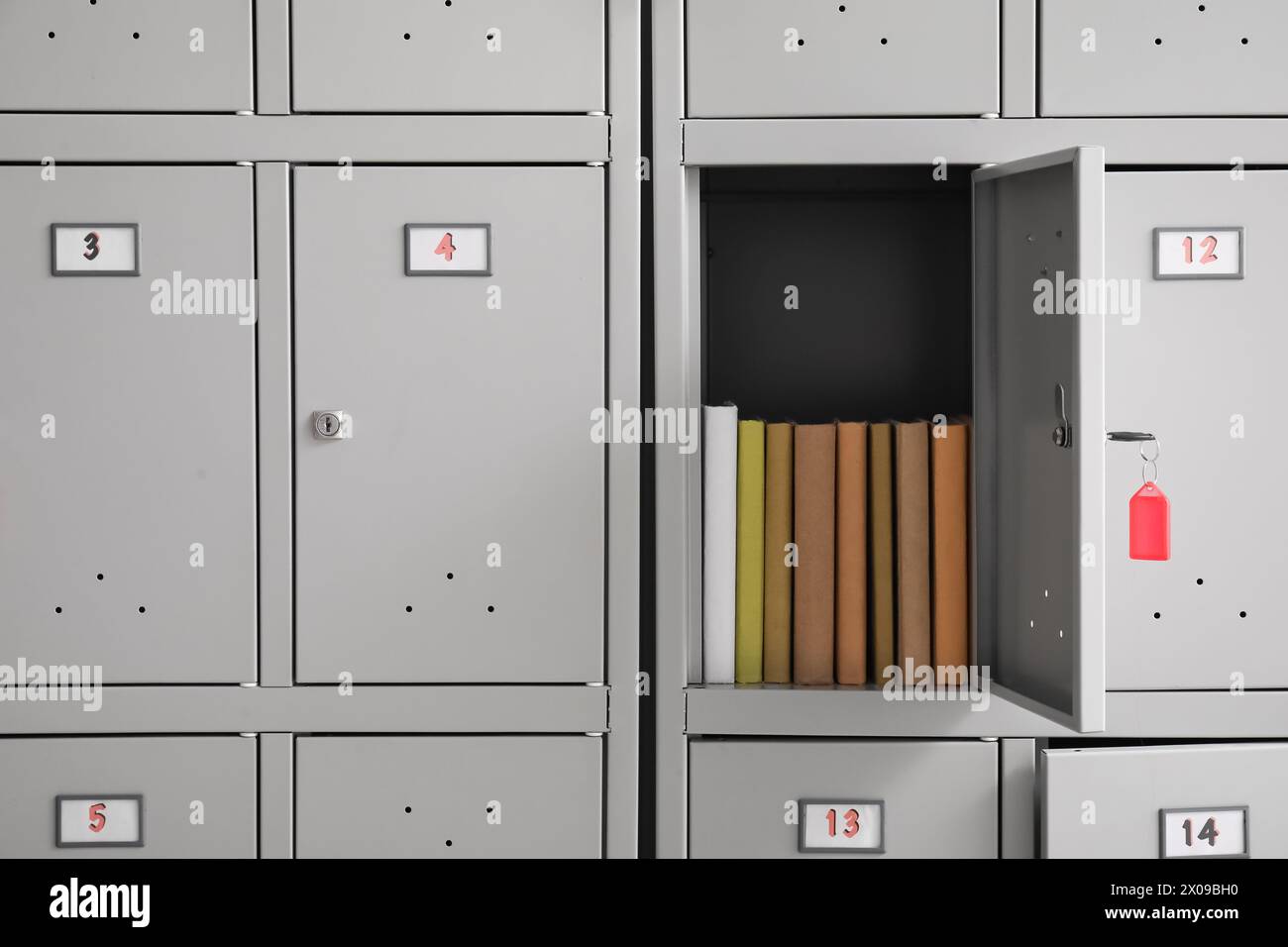 Modern locker with books at school, closeup Stock Photo - Alamy
