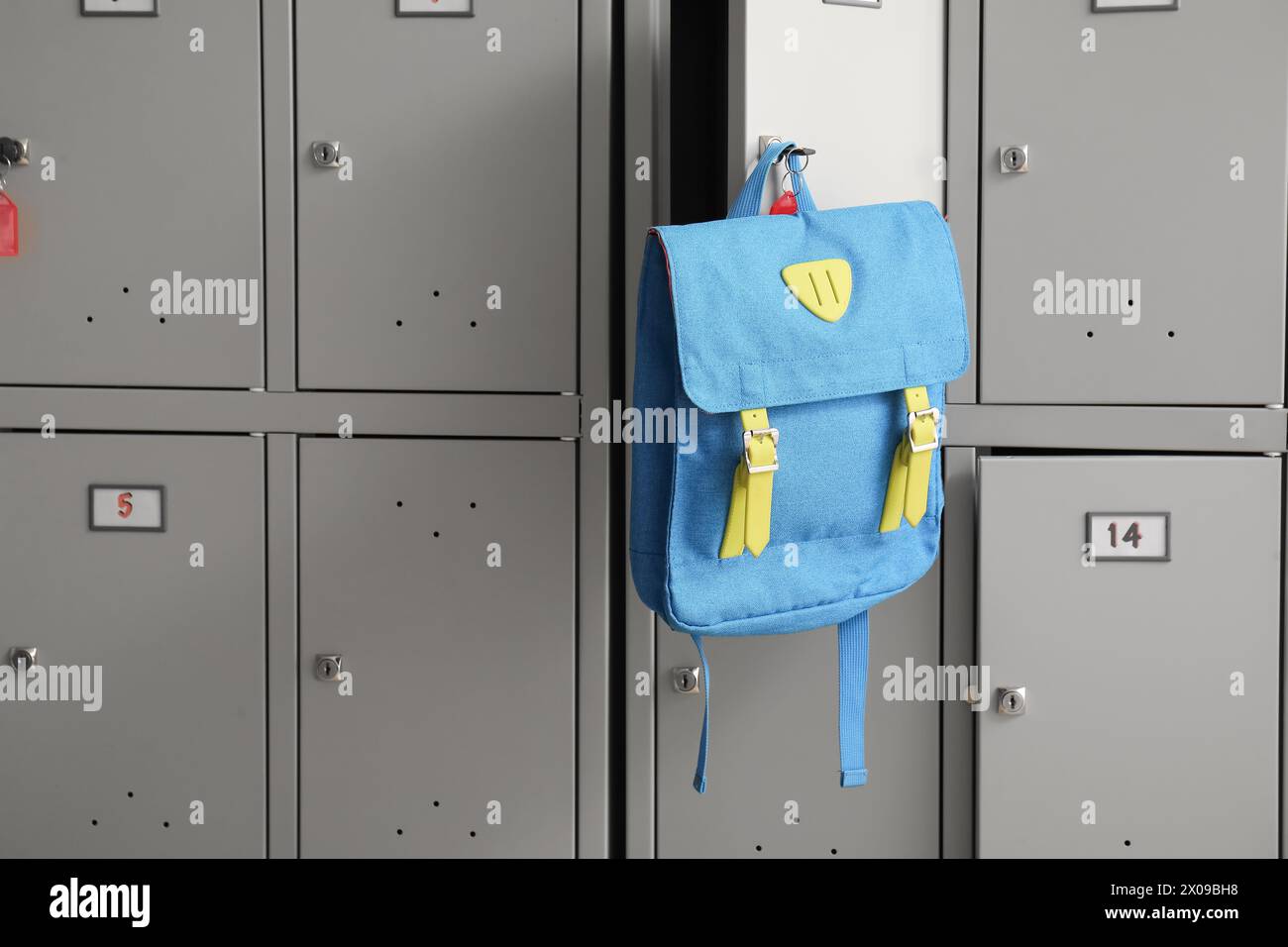 Modern locker with backpack at school, closeup Stock Photo - Alamy