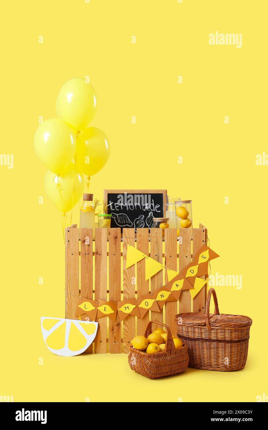 Lemonade stand with chalkboard and balloons on yellow background Stock ...
