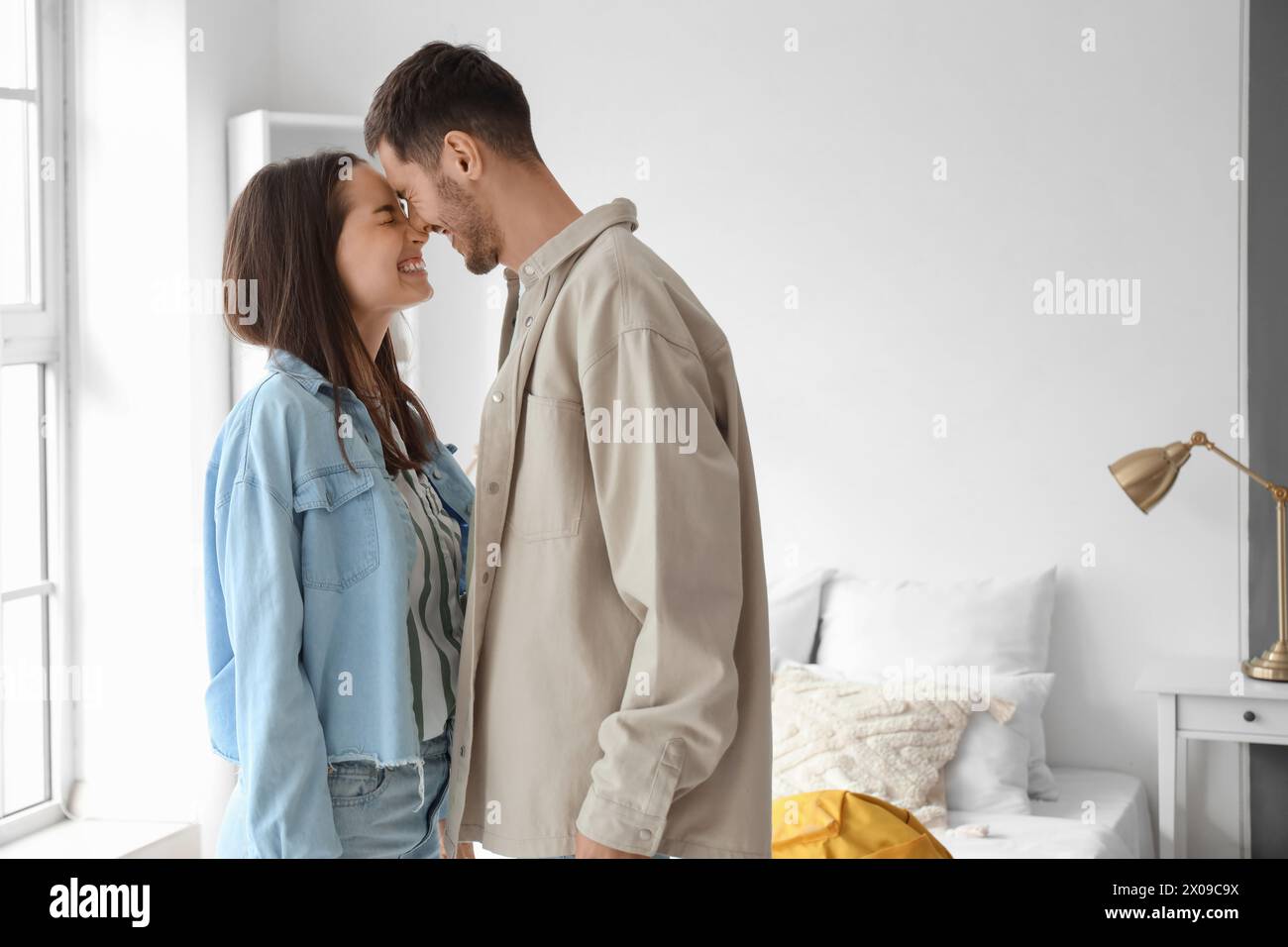 Happy tourists checking in hotel room Stock Photo - Alamy