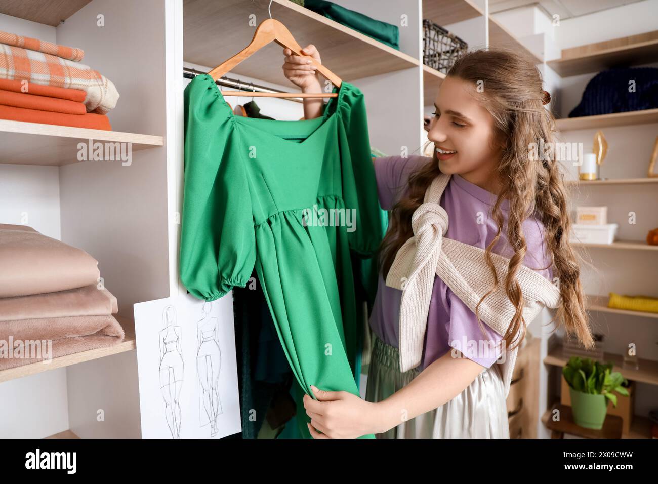 Female tailor with dress in atelier Stock Photo - Alamy