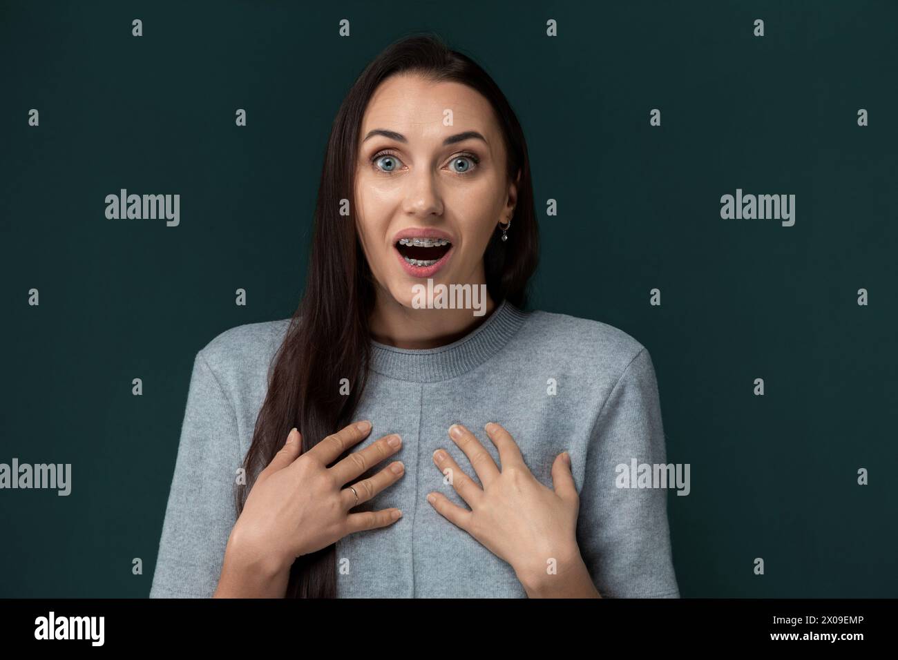 A woman is depicted with a facial expression indicating surprise, her ...