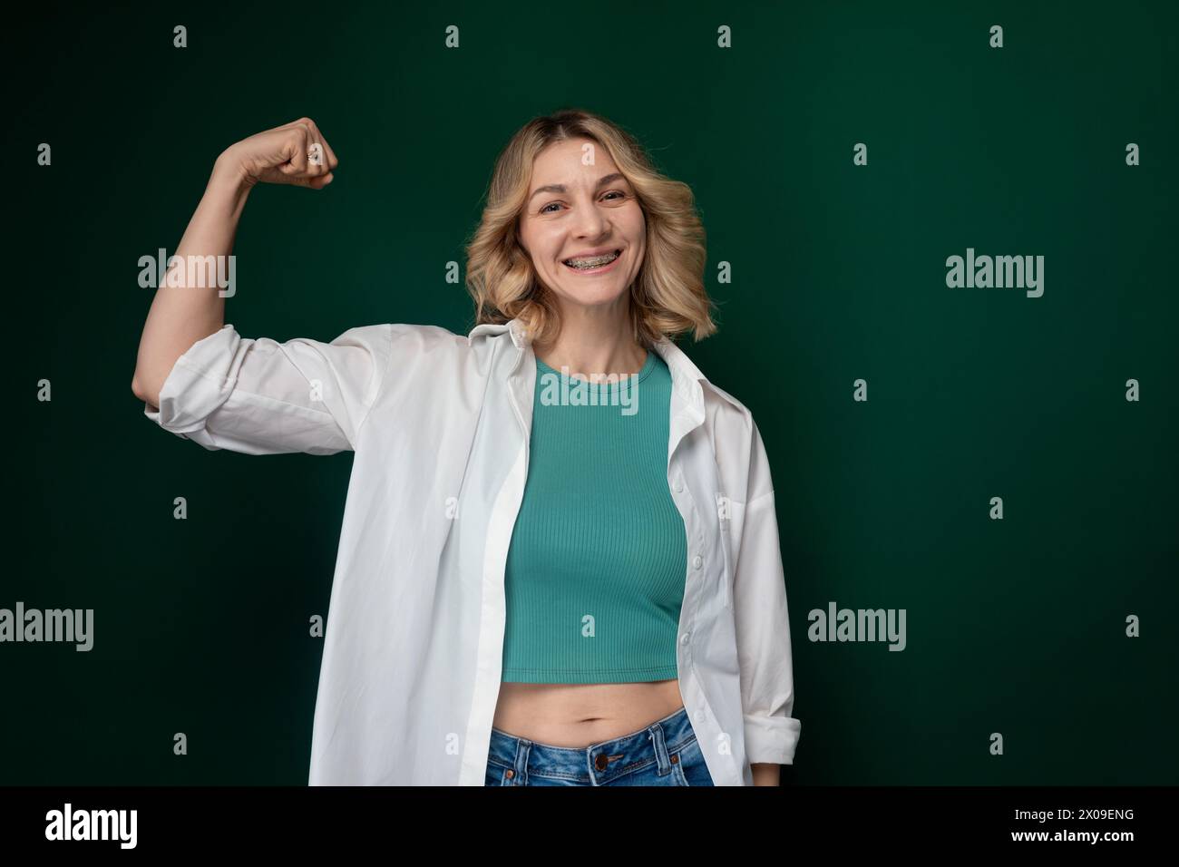 Woman Posing With Fist Up Stock Photo - Alamy