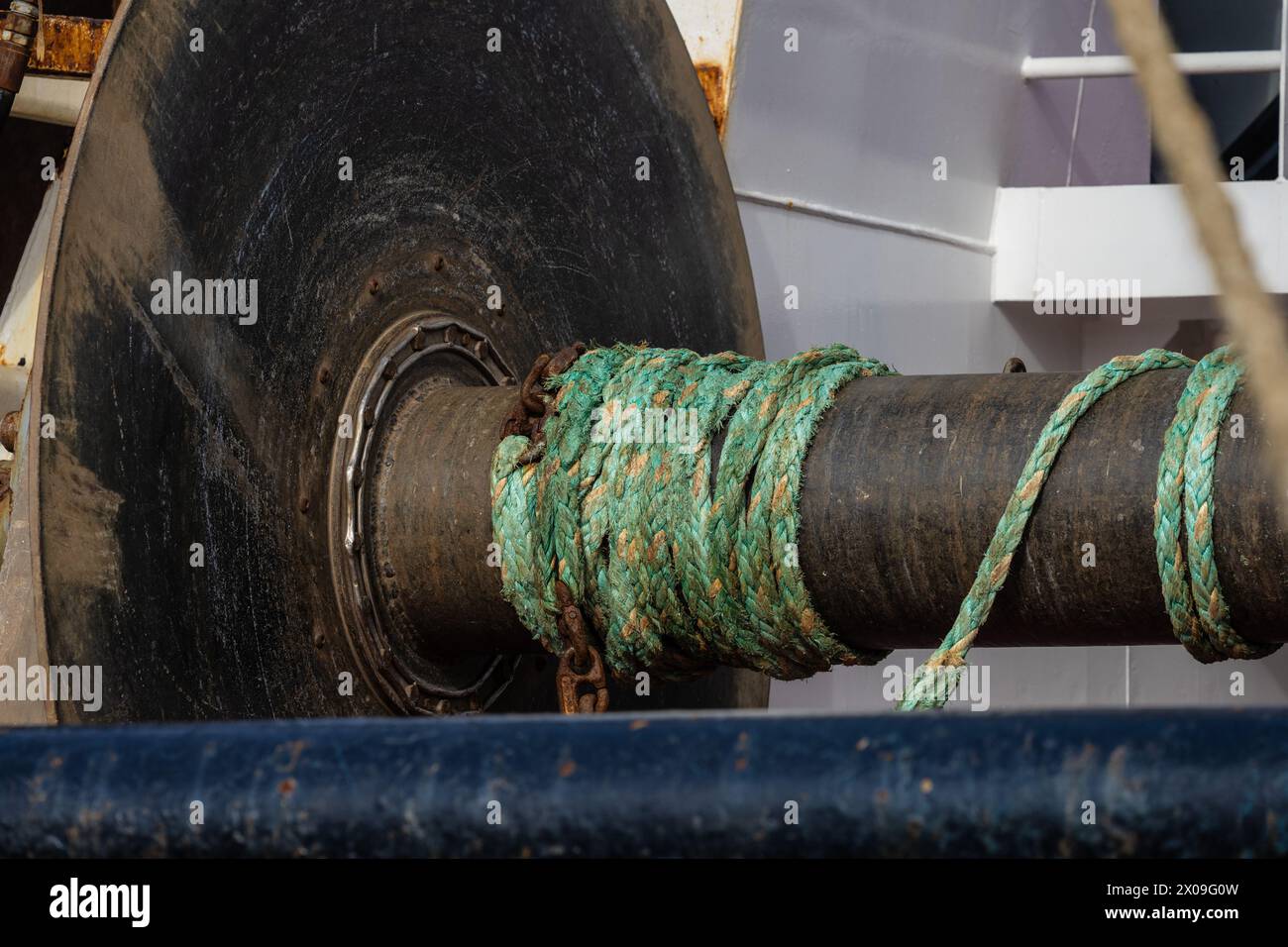 A few meters of rope on a large metal drum on a trawler Stock Photo - Alamy