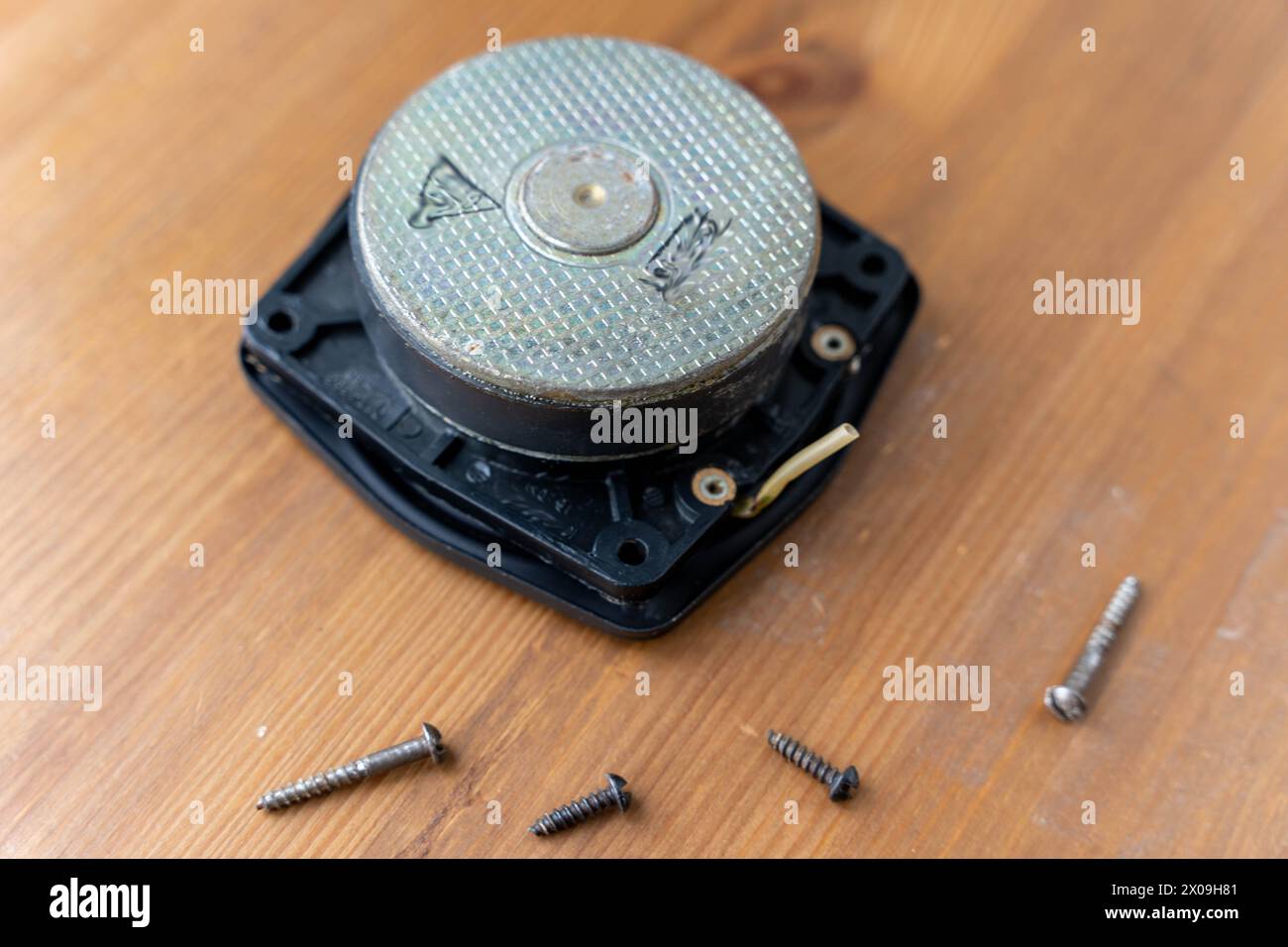 disassembled speaker showing its components, including a circuit board ...