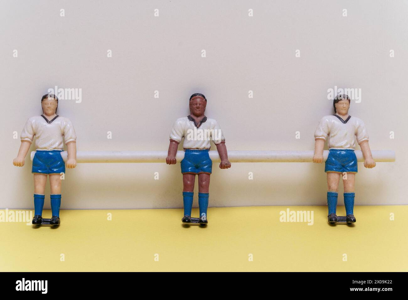 Three figurines of people,football players. mini football team ...
