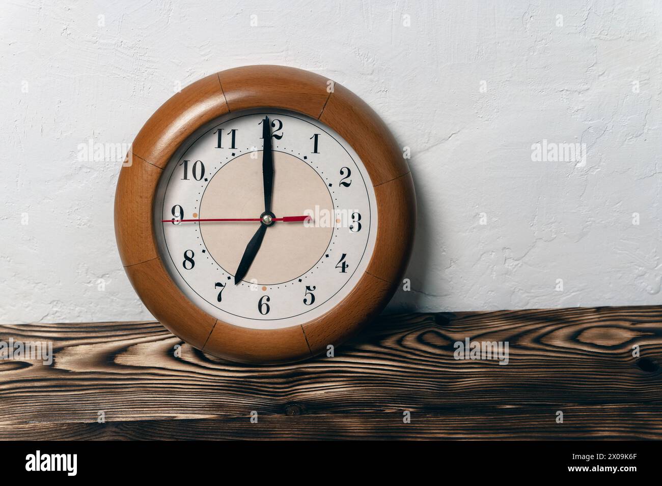 clock with hands showing the time 7-00, seven o'clock in the morning ...