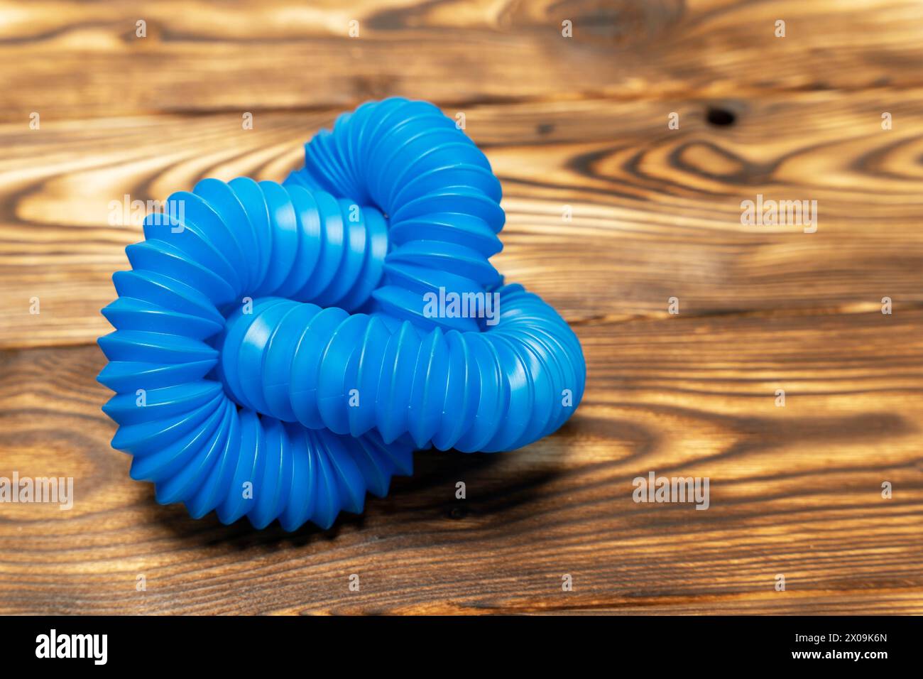 blue children's corrugated pipe toy. Pop Tubes, pipe accordion ...