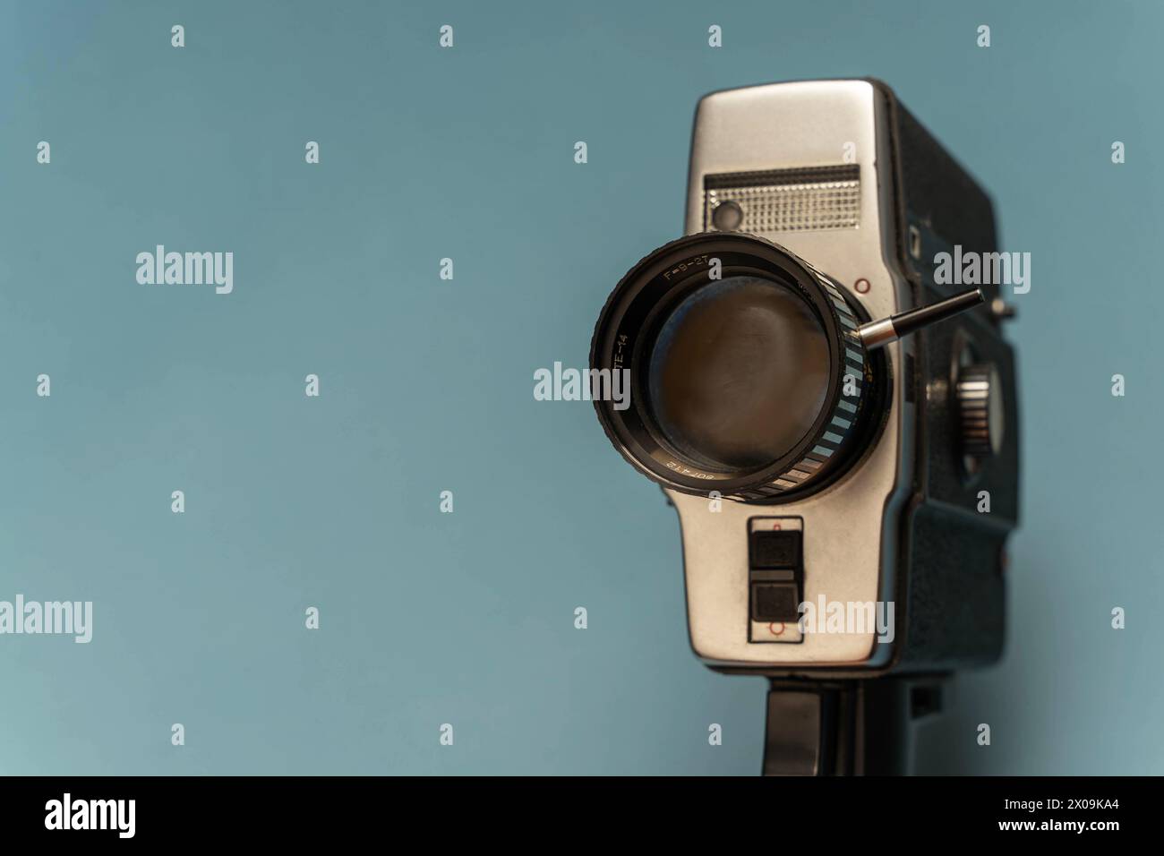 A close-up of a vintage movie camera shooting on 8 mm film from the 80s ...