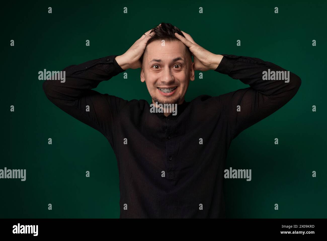 Man With Hands on Head Stock Photo - Alamy