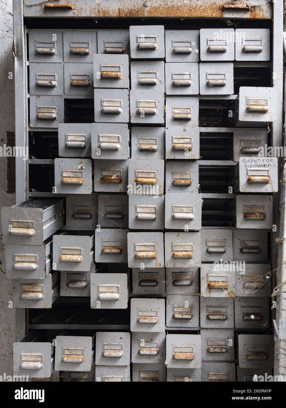 Metal drawer unit in an abandoned industrial building Stock Photo - Alamy
