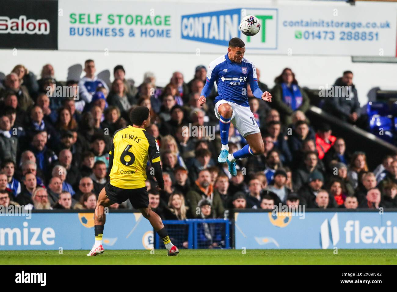 Ipswich, UK. 10th Apr, 2024. Watford's Jamal Lewis battles for the ball ...