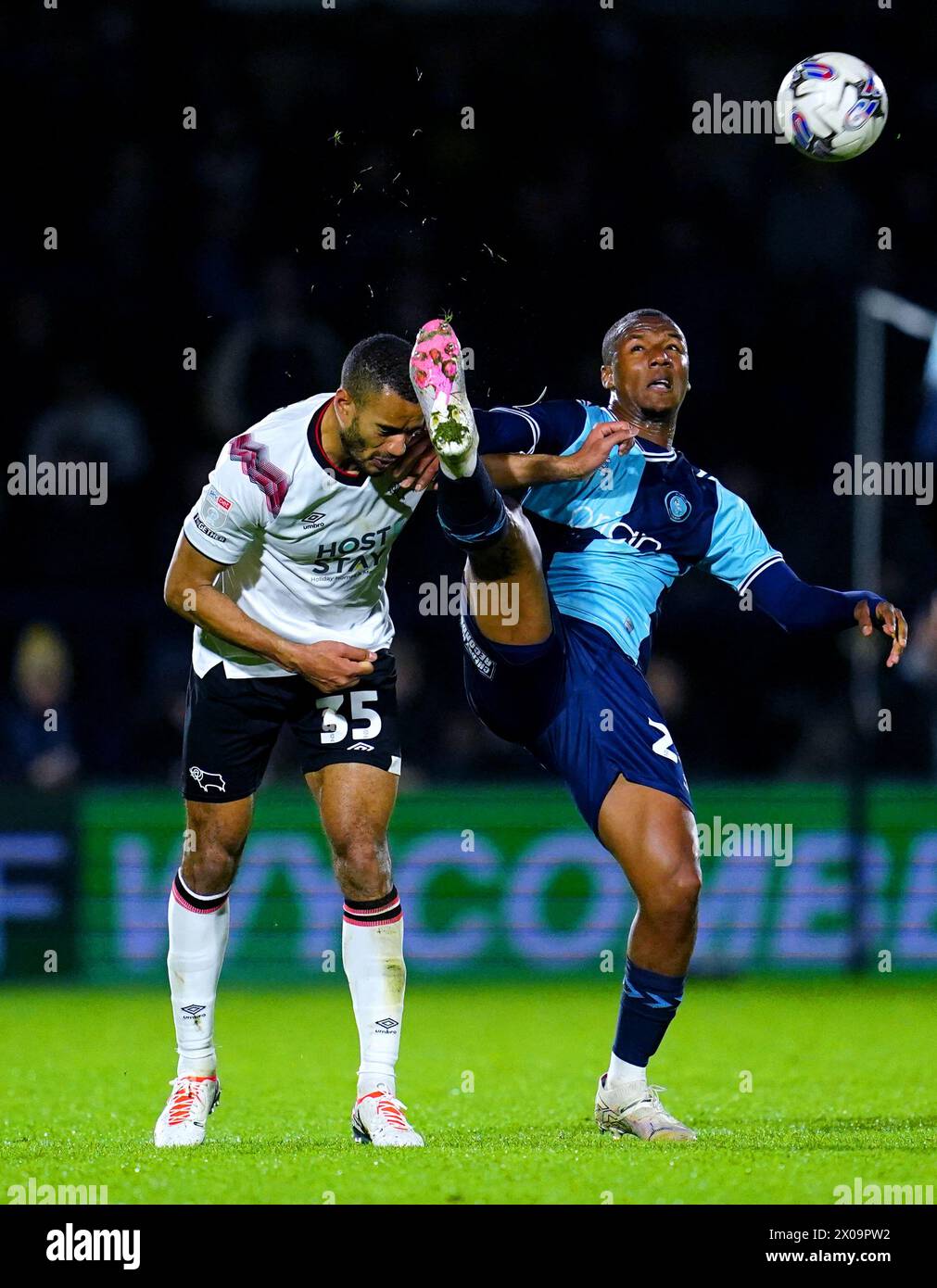 Derby County's Curtis Nelson (left) and Wycombe Wanderers' Richard Kone ...