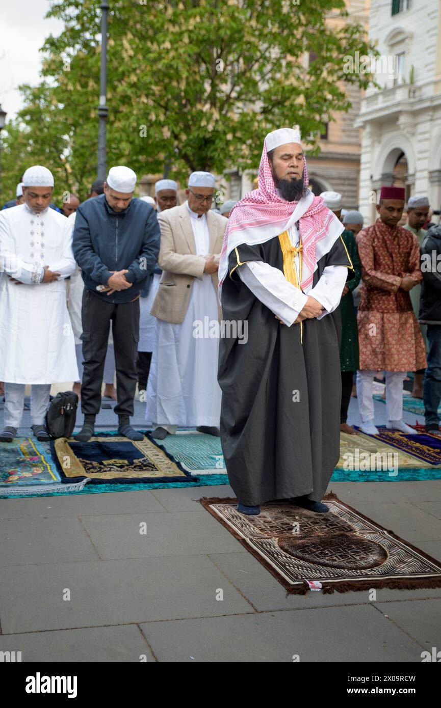 Rome, Italy. 10th Apr, 2024. An Imam leads the prayer of Muslim men on ...