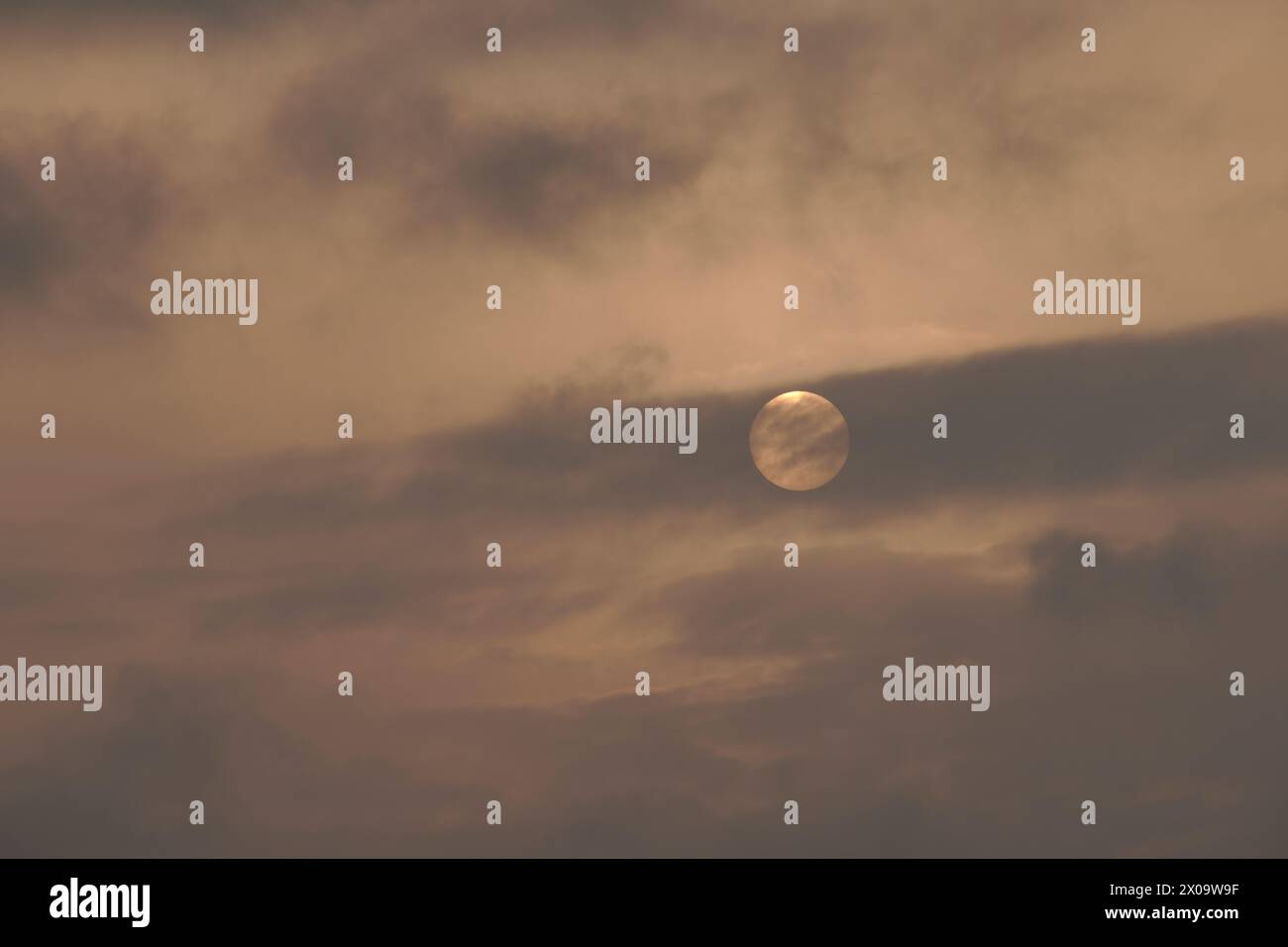 Sky, with diffused sun clouds colourful. A Celestial Dance: Sun and ...