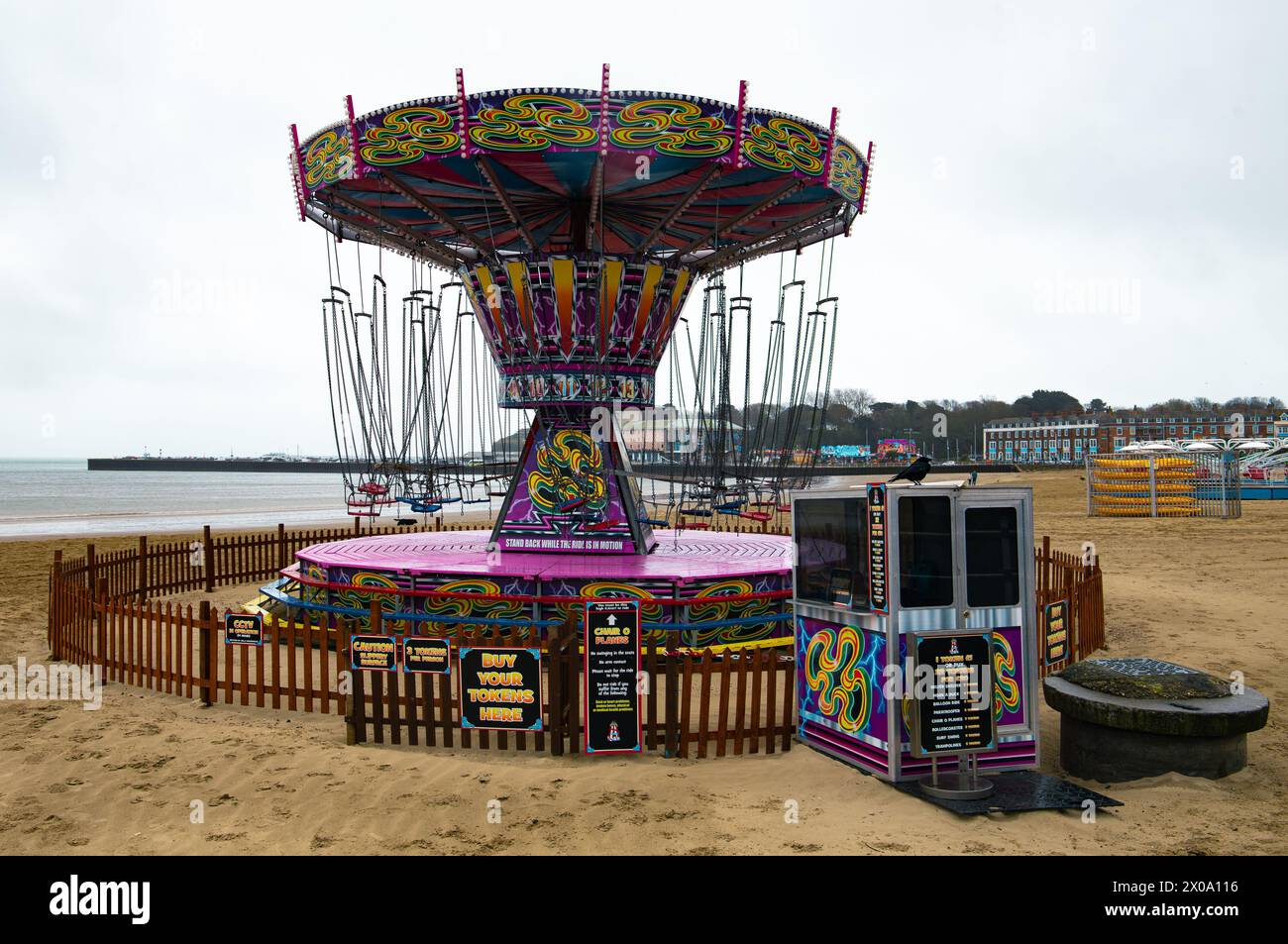 Out of service Chair-O-Planes funfair ride on Weymouth beach Dorset UK ...