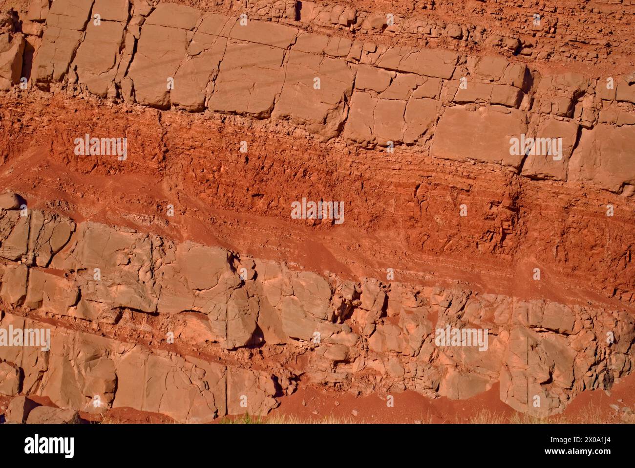 Red, iron-rich layered rock wall, texture detail close up Stock Photo ...